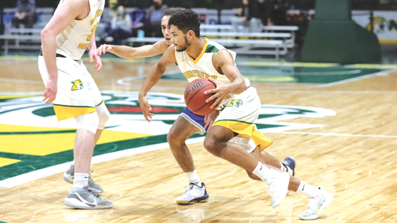 Northern Michigan University Wildcats men’s basketball team at home ...